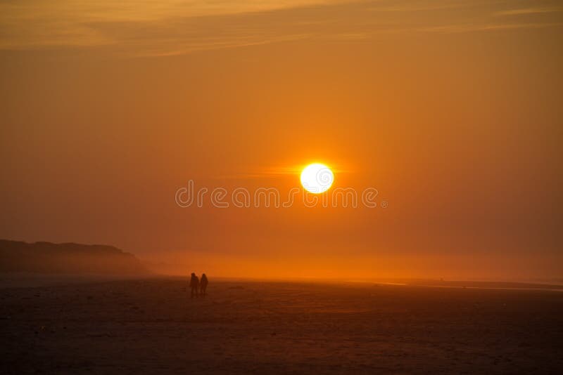 Two People Hand in Hand on Beach at Sunset Stock Photo - Image of ...