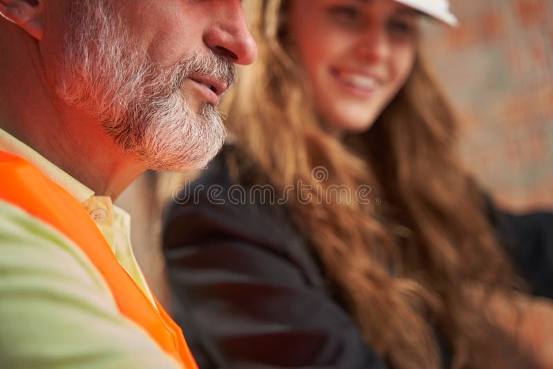 Two People in Hardhats and Visibility Vests Posing for Camera Stock ...