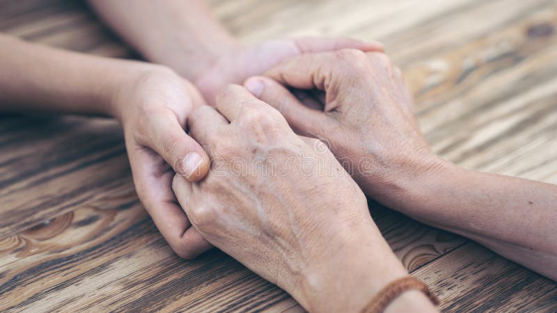 Two People Holding Hands with Compassion and Love Stock Image - Image ...