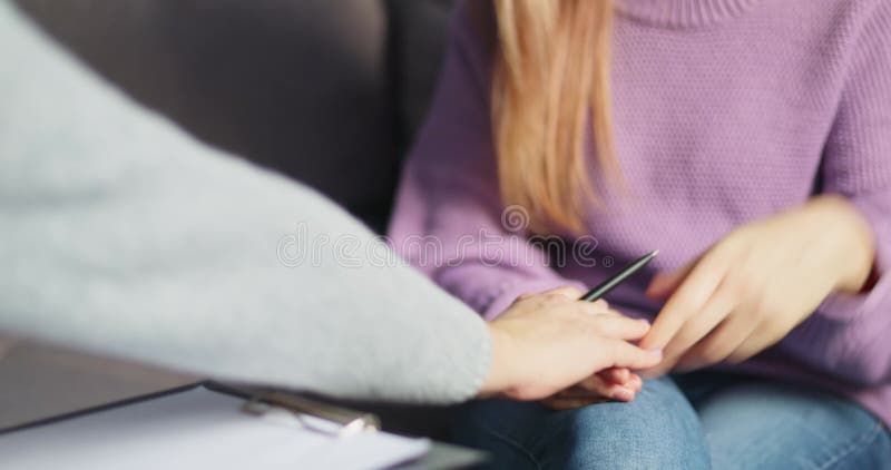 Two People Holding Hands in Support during a Consultation Session Stock ...