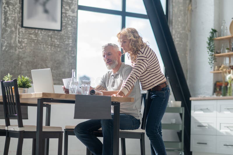 Two People at the Laptop Looking Involved and Discussing Something ...