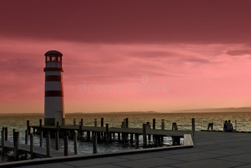 Two people at a lighthouse stock image. Image of lake - 2879635