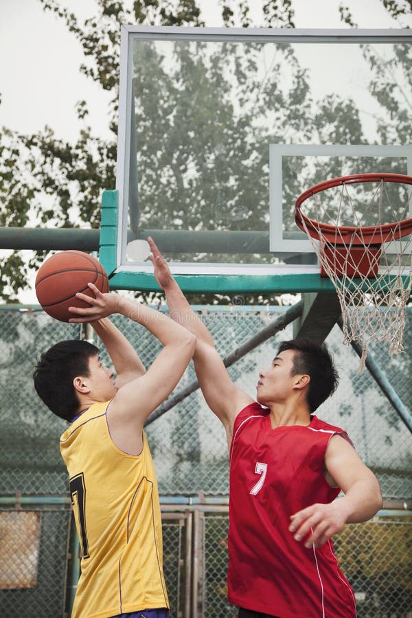 Two People Playing Basket Ball Stock Image - Image of city, control ...