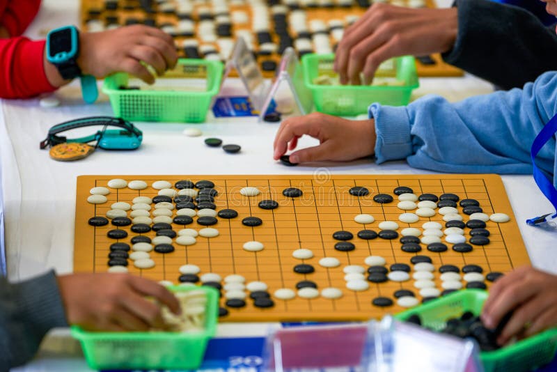 Two People are Playing Go in a Competition, Go Match Scene Stock Image ...