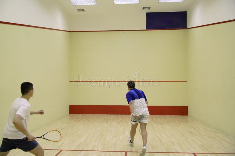 Two person playing squash stock image. Image of effort - 528583
