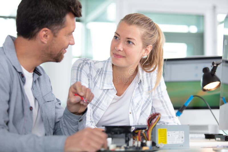 Two people repairing pc stock photo. Image of baseunit - 317245436