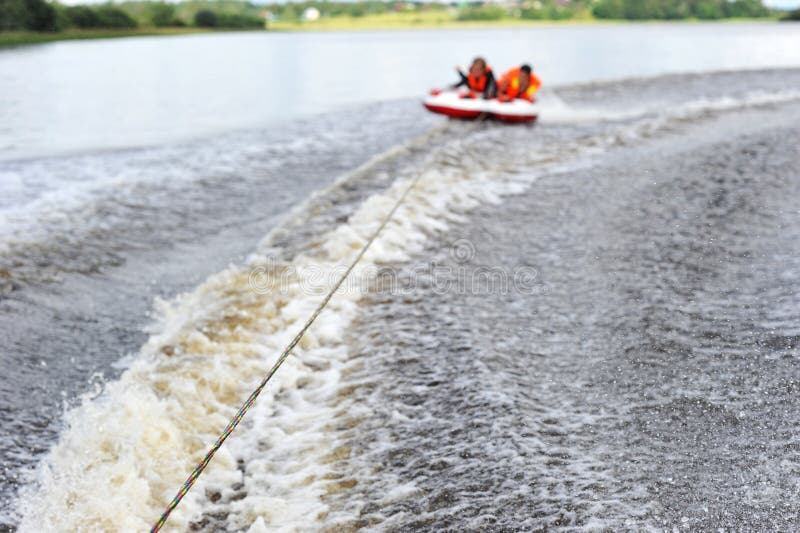Two People Ride on a Water Tube Stock Image - Image of leisure ...