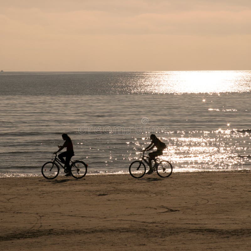 Two people riding bicycles stock photo. Image of peace - 4747010
