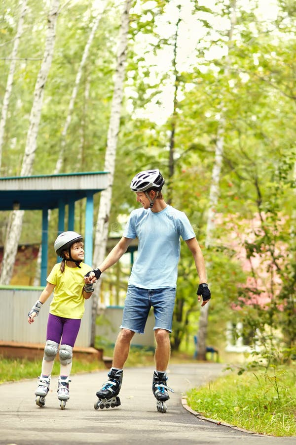 Two people rollerblade stock photo. Image of baby, protect - 38631468