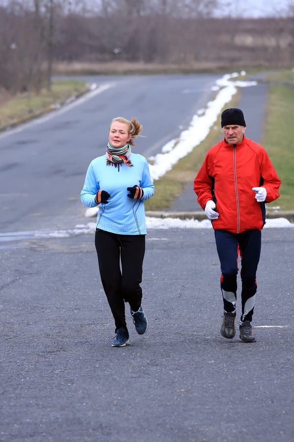 Two people running stock photo. Image of leisure, exercise - 13044040