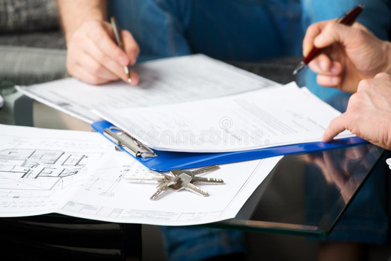 Two People Signing a Document Stock Photo - Image of form, paper: 30835498