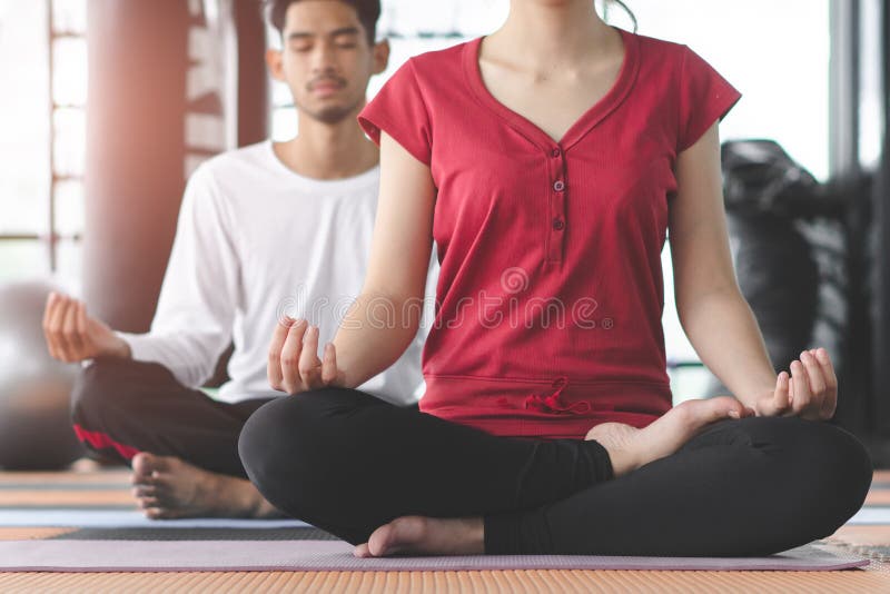 Two People Sitting on Mat and Practicing Meditation Stock Photo - Image ...