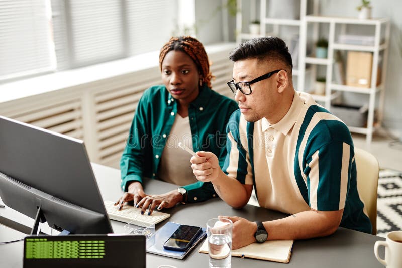 Two People in Software Development Stock Photo - Image of asian, young ...