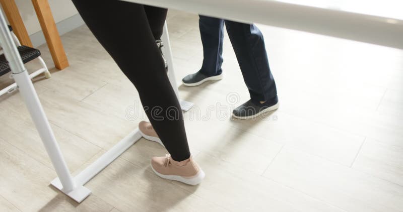 Two People Standing in Prosthetic Lab, One with a Prosthetic Leg ...