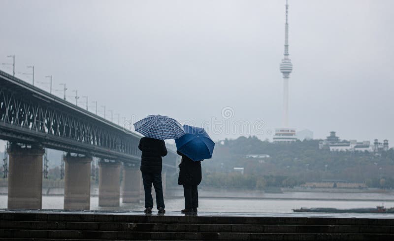 Two People Standing Side by Side with Umbrellas during Rain Editorial ...