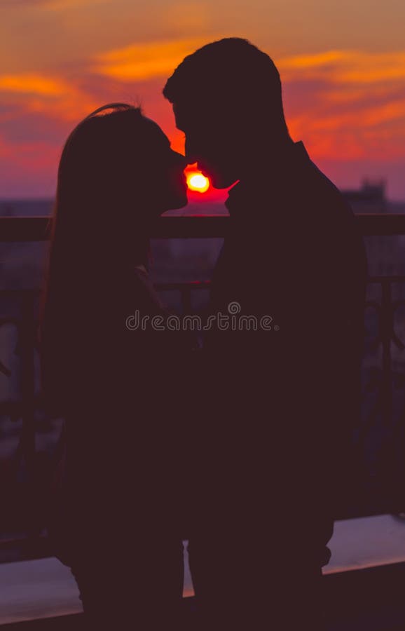 Two people sunset stock photo. Image of evening, romance - 80760912