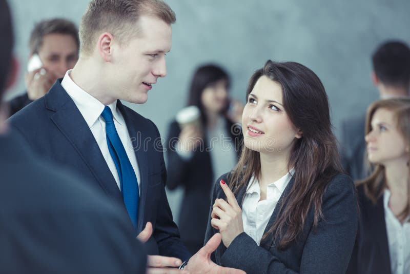 Two People Talking in the Crowd Stock Image - Image of talk, mass: 77973823