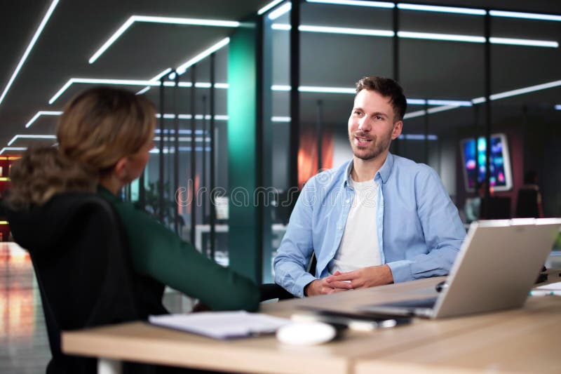 Two People Talking at Meeting Stock Photo - Image of laptop, advising ...