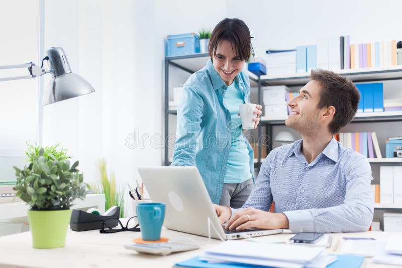 Two People Using a Computer in the Office Stock Photo - Image of ...