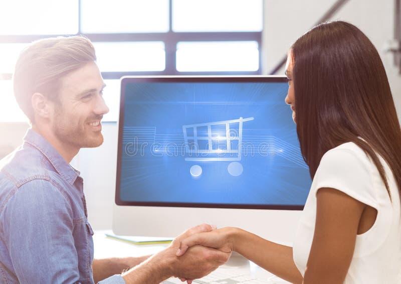 Two People Using Computer with Shopping Trolley Icon Stock Photo ...