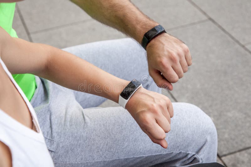 Two People Using Smart Sport Watch at Workout. Stock Image - Image of ...