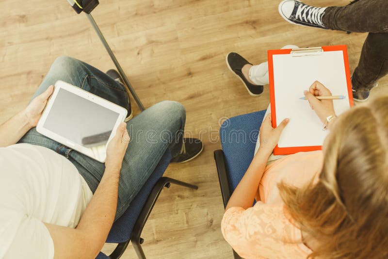 Two People Using Tablet and Note Pad Stock Image - Image of digital ...