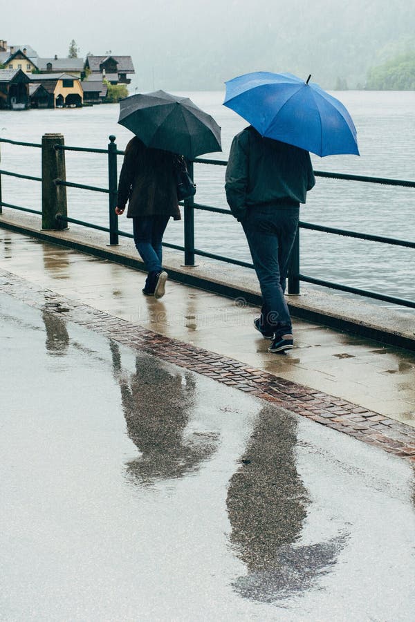 Two People Walking in the Street on a Rainy Day Stock Image - Image of ...