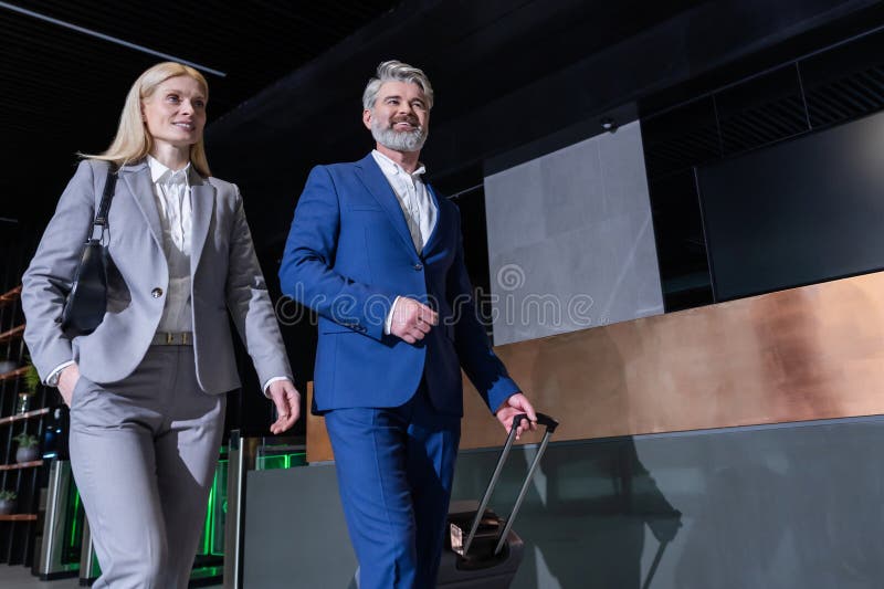 Two People Walking Together To the Airport Exit after Arrival Stock ...