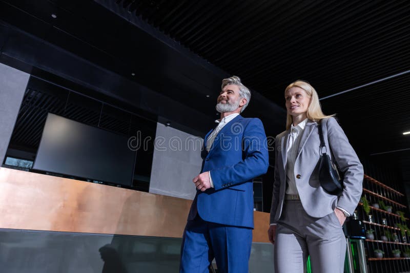 Two People Walking Together To the Airport Exit after Arrival Stock ...