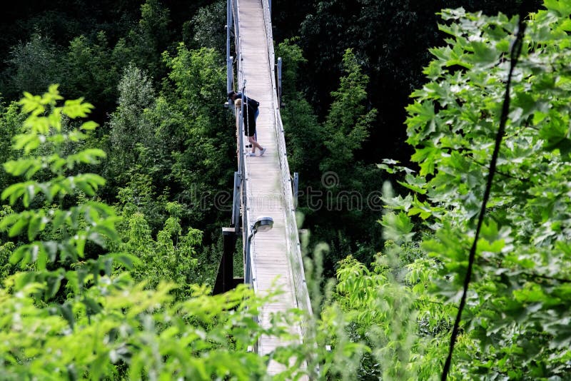 Two People on a Wooden Bridge Over the Precipice Stock Image - Image of ...