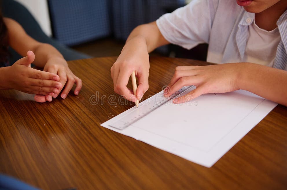 Two People Working with a Ruler Stock Photo - Image of indoors ...