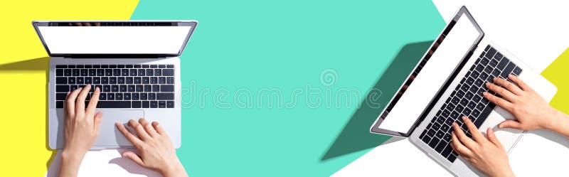 Two People Working Together with Laptop Computers Stock Image - Image ...