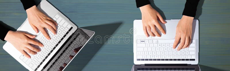Two People Working Together with Laptop Stock Photo - Image of teamwork ...