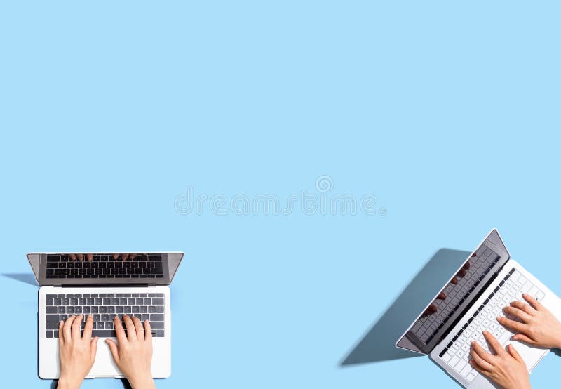 Two People Working Together with Laptops Stock Image - Image of table ...