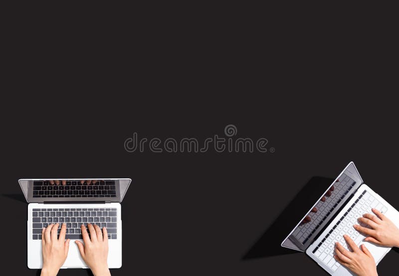 Two People Working Together with Laptops Stock Photo - Image of dark ...