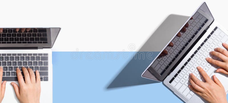 Two People Working Together with Laptops Stock Image - Image of ...