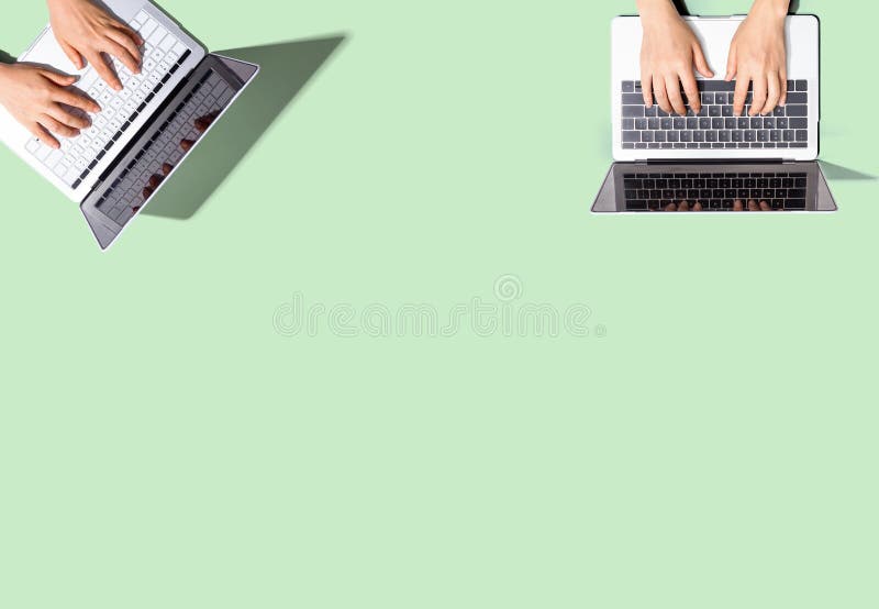 Two People Working Together with Laptops Stock Photo - Image of copy ...