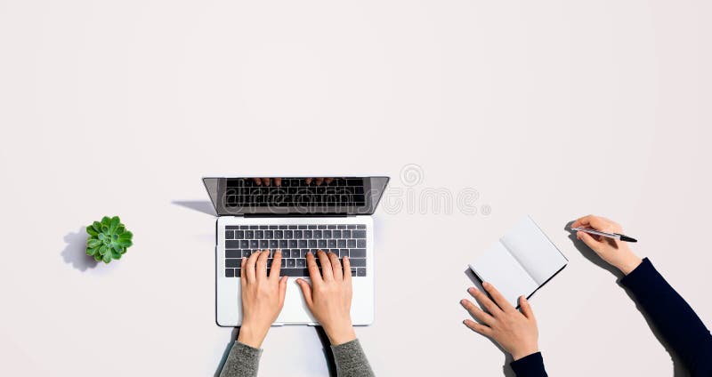 Two People Working Together Stock Photo - Image of supplies, notebook ...