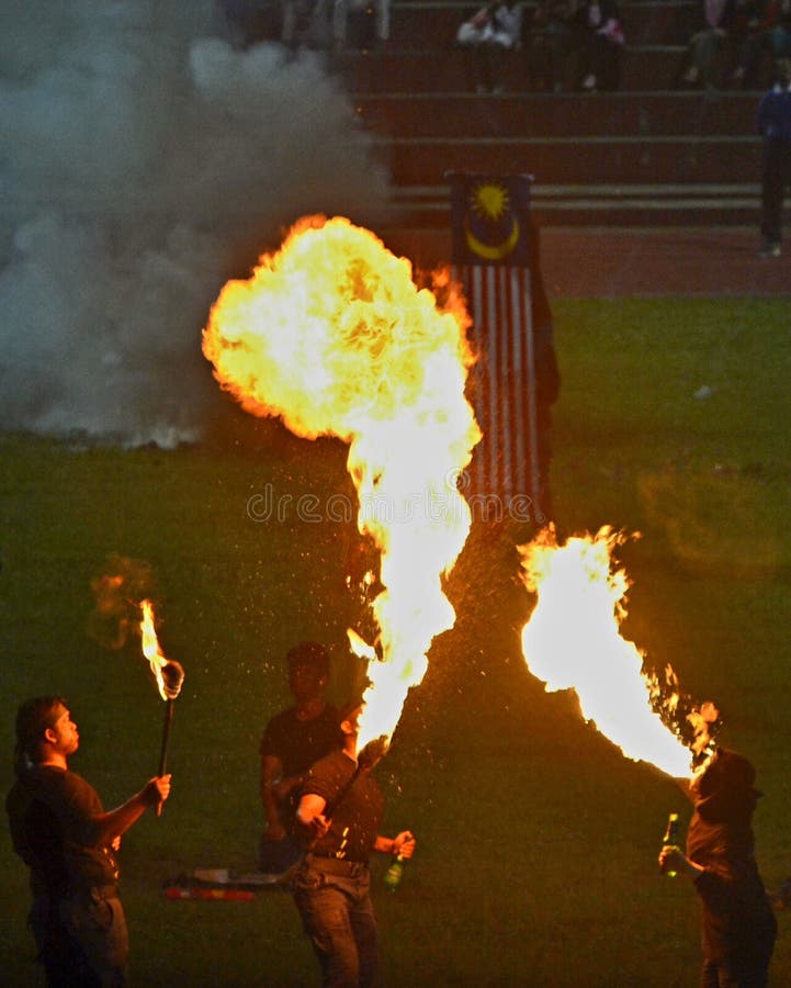 Two Performers Demonstrates a Fire Performance during an Evening Event ...