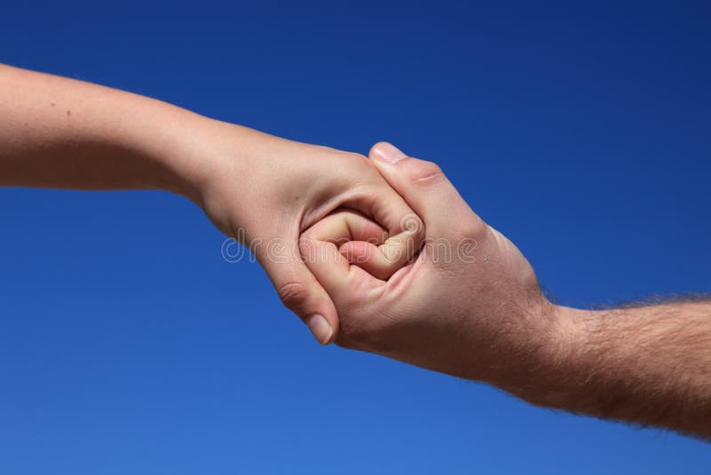 Two persons holding hands stock photo. Image of helpfulness - 19923006
