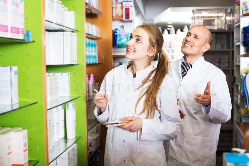 Two Pharmacists in Chemist Shop Stock Image - Image of manager, person ...