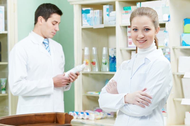 Two Pharmacy Chemist Workers in Drugstore Stock Image - Image of girl ...
