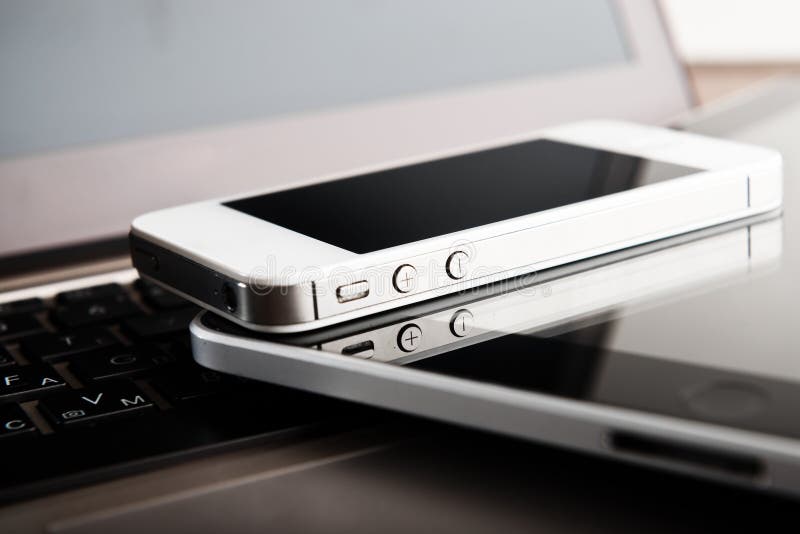 Two Phones and Tablet Pc on Laptop Stock Image - Image of network ...