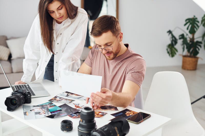 Two Photographers in Casual Clothes is Working Indoors at Daytime Stock ...