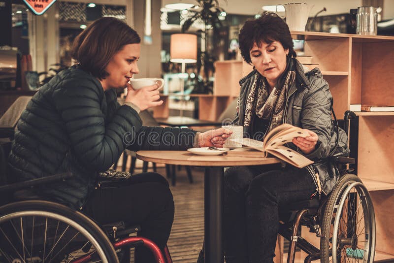 Two Physically Challenged Women in a Cafe Stock Image - Image of ...