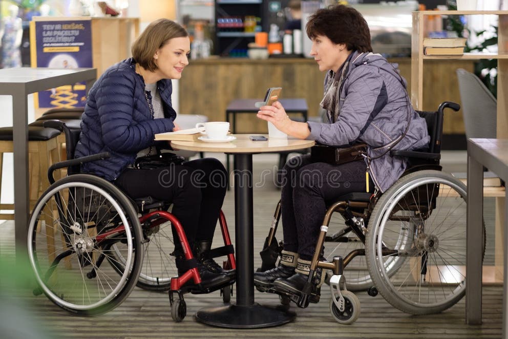 Two Physically Challenged Women in a Cafe Stock Image - Image of ...