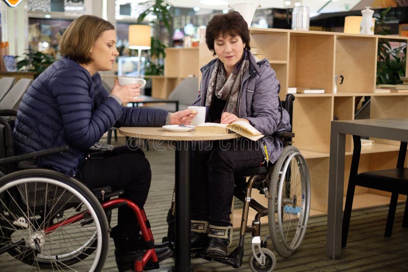 Two Physically Challenged Women in a Cafe Stock Photo - Image of ...