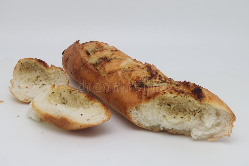 Two Pieces are Broken Off a Loaf of Garlic Bread. Garlic Bread on a ...