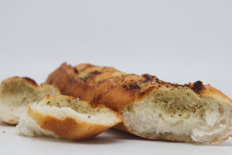 Two Pieces are Broken Off a Loaf of Garlic Bread. Garlic Bread on a ...