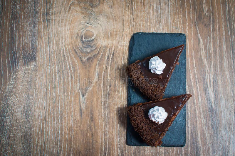 Two Pieces of Cake on a Stone Plate Stock Image - Image of table ...